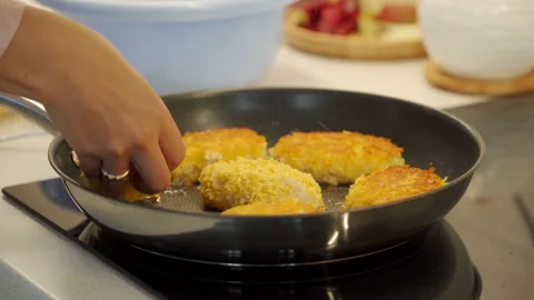 Drops of hot oil splash on the kitchen c... | Stock Video | Pond5