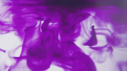 Drops of purlple ink falling and flowing... | Stock Video | Pond5