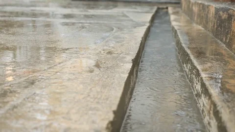 drops of rain fall in the autumn puddle.... | Stock Video | Pond5