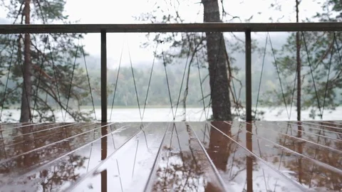 Drops of rain fall on the balcony, wet w... | Stock Video | Pond5