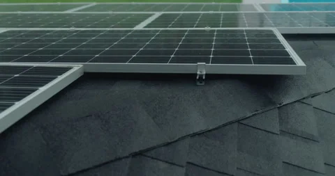Drops of rain fall on the solar panels o... | Stock Video | Pond5