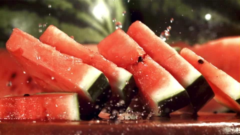 Drops of water fall on a pieces of water... | Stock Video | Pond5