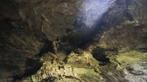 Drops of water falling from cave ceiling | Stock Video | Pond5