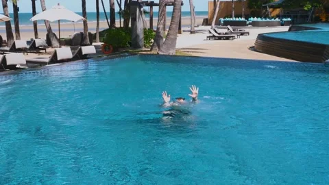 Drowning panic man in resort swimming po... | Stock Video | Pond5