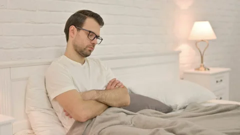 Drowsy Young Man Falling Asleep Sitting ... | Stock Video | Pond5