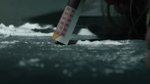 Drug addict snorting line of cocaine | Stock Video | Pond5