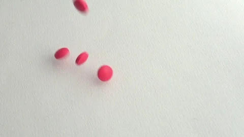 Drug falling on white background,slow mo... | Stock Video | Pond5