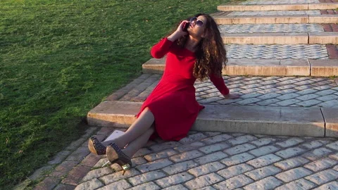 Drunk girl sitting on the steps in the p... | Stock Video | Pond5