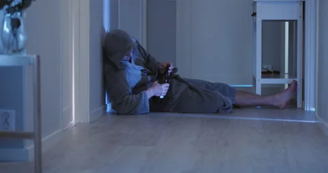 Drunk man dressed in hooded bathrobe lyi... | Stock Video | Pond5