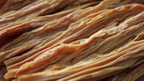Dry brown soy Fuzhu (Tofu skin, yuba) st... | Stock Video | Pond5