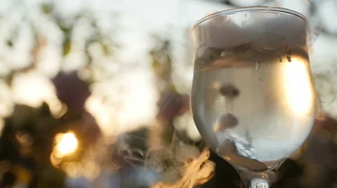 Dry ice on a glass of wine at a receptio... | Stock Video | Pond5