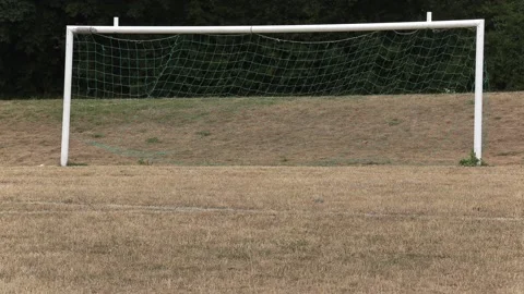 Dry soccer field and brown grass and dro... | Stock Video | Pond5