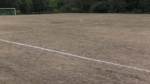 Dry soccer field and brown grass and dro... | Stock Video | Pond5