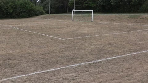 Dry soccer field and brown grass and dro... | Stock Video | Pond5