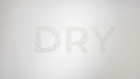 Dry word blown off the wet glass on grey... | Stock Video | Pond5