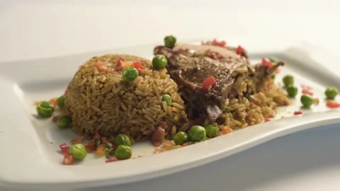 duck, rice ali onion peruvian food COO... | Stock Video | Pond5