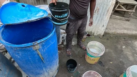 Due to water shortage, a person is pouri... | Stock Video | Pond5