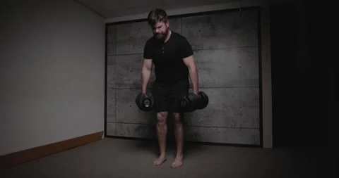 Dumbbell bent over row, cinematic lighti... | Stock Video | Pond5