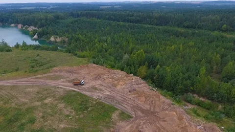 Dump truck carries sand on the backgroun... | Stock Video | Pond5
