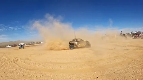 Dust from a dune buggy in the Mojave Des... | Stock Video | Pond5