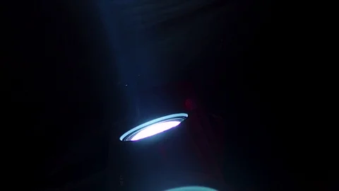 Dust floating through light beam of a pr... | Stock Video | Pond5