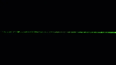 Dust particles in green laser light beam... | Stock Video | Pond5
