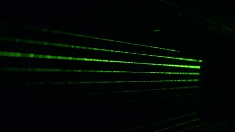 Dust particles in green laser light beam... | Stock Video | Pond5