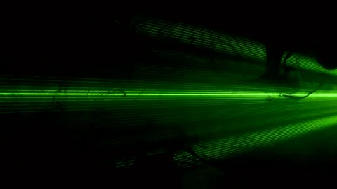 Dust particles in green laser light beam... | Stock Video | Pond5