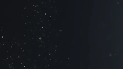 dust particles over black background wit... | Stock Video | Pond5