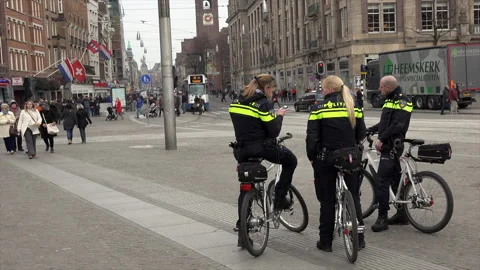 Dutch police on bike patrol in Dam Squar... | Stock Video | Pond5