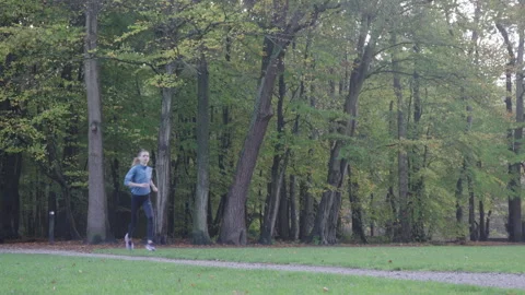Dynamic shot of a woman running towards ... | Stock Video | Pond5