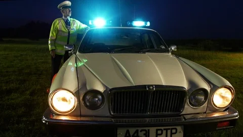 E 1980s British copper with police car f... | Stock Video | Pond5