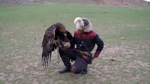 Eagle trainer and his golden eagle in Ky... | Stock Video | Pond5