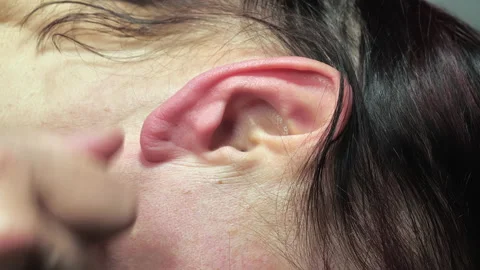 The ear of the lady turning to red after... | Stock Video | Pond5