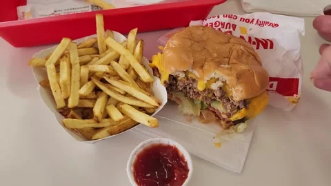 Eating IN-N-Out Burger Fast Food Restaur... | Stock Video | Pond5