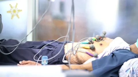 ECG or EKG Legs of man with electrodes f... | Stock Video | Pond5