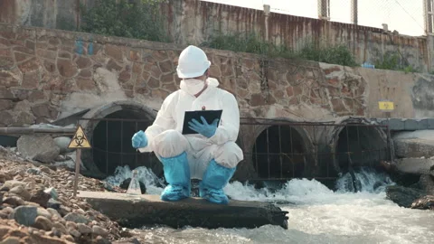 Ecologist sampling water of toxic chemic... | Stock Video | Pond5