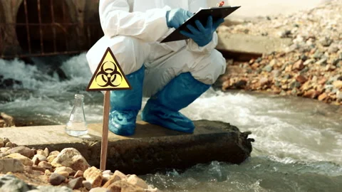 Ecologists sample water contaminated wit... | Stock Video | Pond5