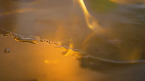 edge of alcohol puddle on fire while eva... | Stock Video | Pond5