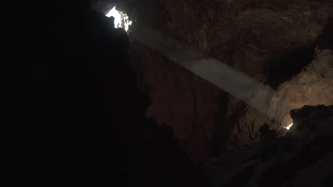 Eerie cave with ray of light.Dust Partic... | Stock Video | Pond5
