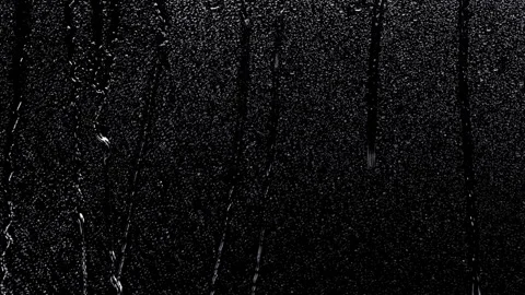 The effect of rain on glass on a black b... | Stock Video | Pond5
