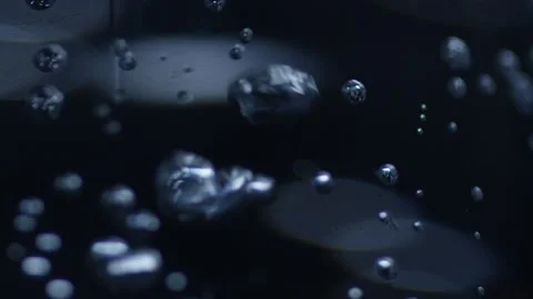 Effervescent air bubbles move up and dow... | Stock Video | Pond5