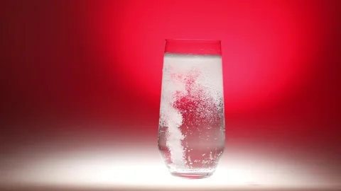 Effervescent Sparkling Water on Red Back... | Stock Video | Pond5