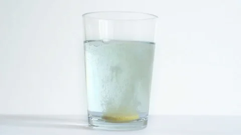 Effervescent tablet dissolving in the gl... | Stock Video | Pond5