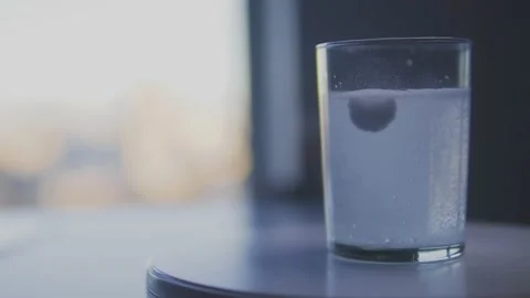 Effervescent tablet dissolving in glass ... | Stock Video | Pond5