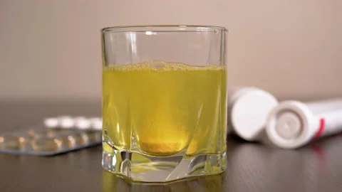 Effervescent Tablet Falling in a Glass o... | Stock Video | Pond5