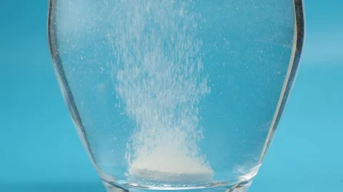 Effervescent tablet in a glass of water ... | Stock Video | Pond5