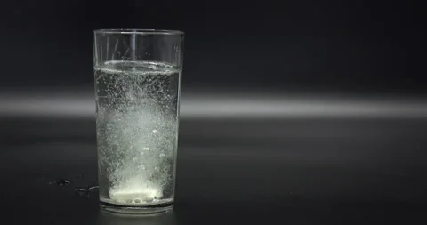 effervescent the tablet is thrown into a... | Stock Video | Pond5