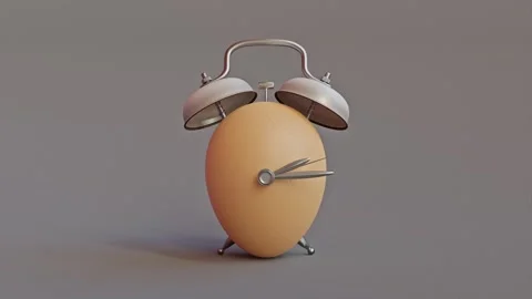 Egg that looks like an alarm clock on gr... | Stock Video | Pond5