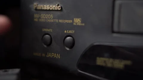 Eject VHS tape cassette from VCR player | Stock Video | Pond5